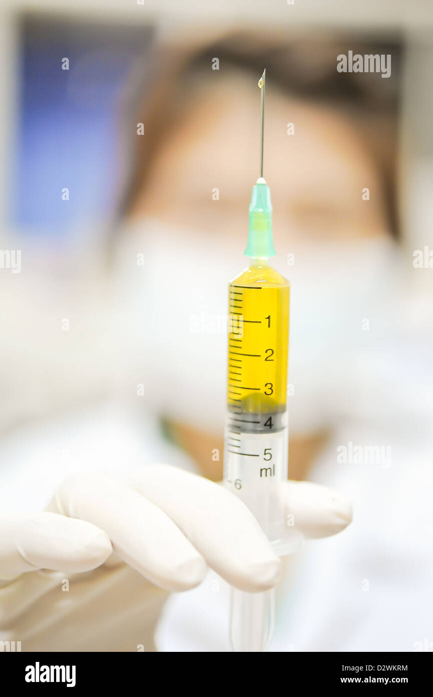doctor using a syringe Stock Photo - Alamy