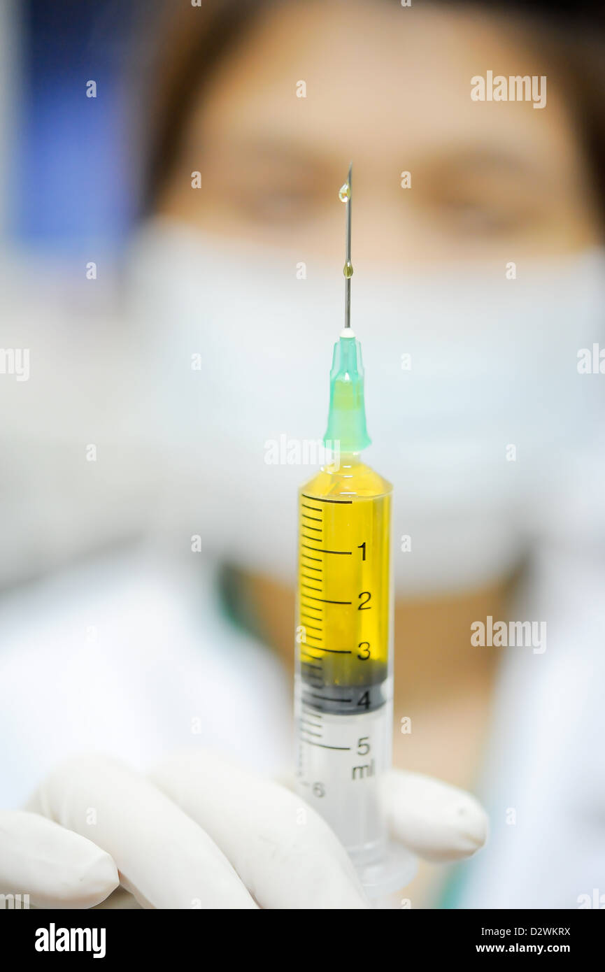 doctor using a syringe Stock Photo - Alamy