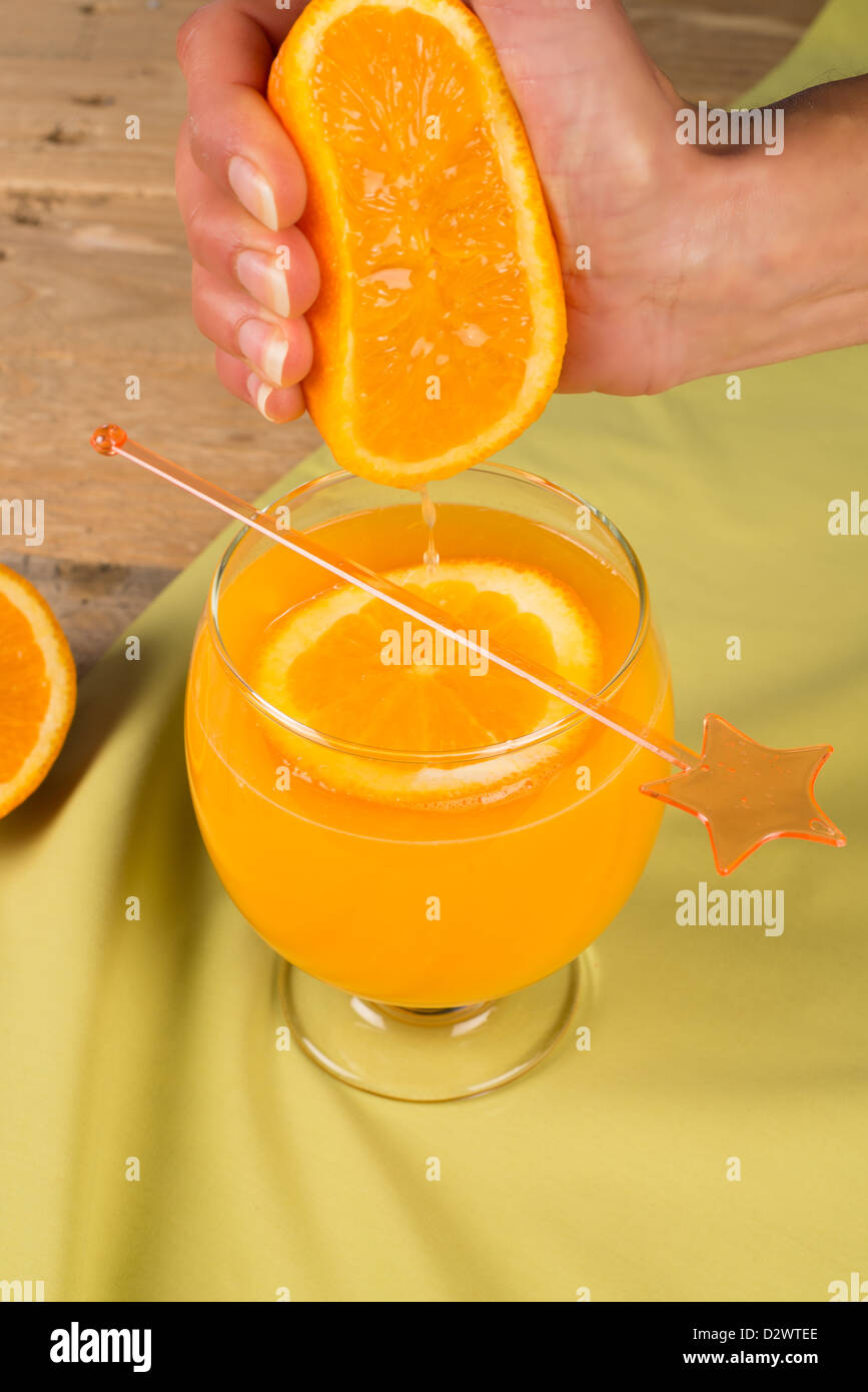 Hand squeezing juice orange glass hi-res stock photography and images ...