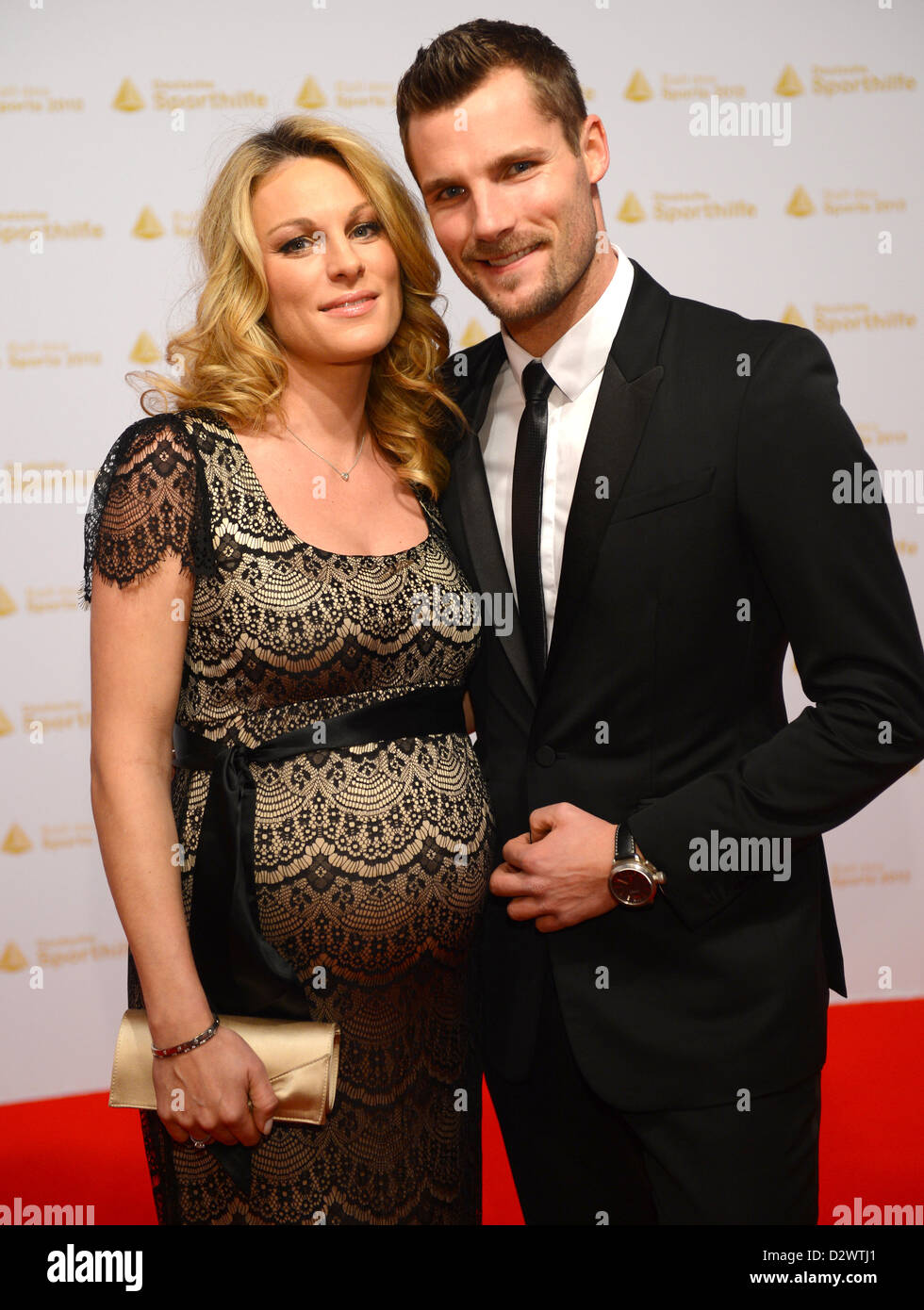 DTM racing driver Martin Tomczyk (R) and his partner Christina Surer ...