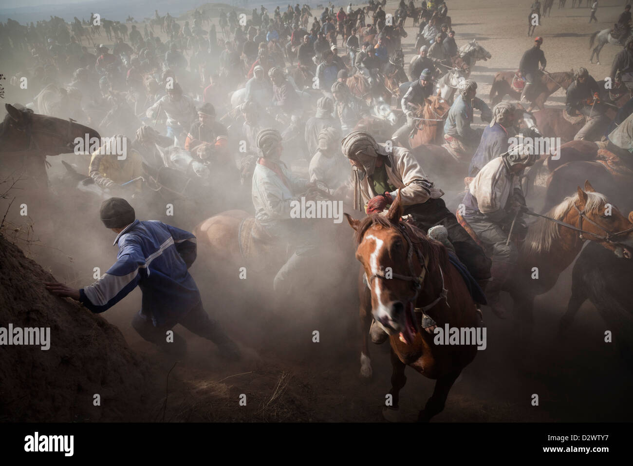 Buzkashi players often lock in clusters in a struggle to pick up the ...