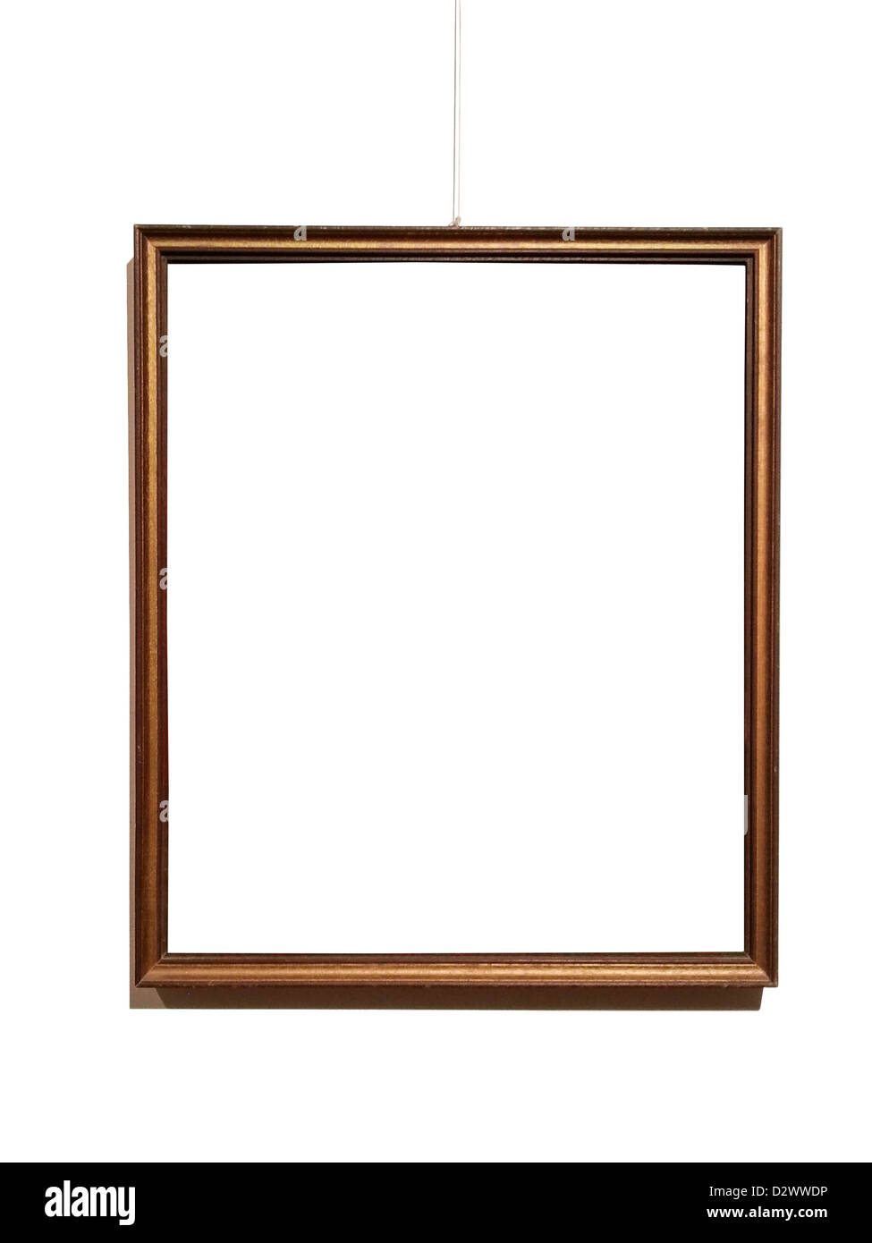 Empty wooden frame hanging on white gallery wall Stock Photo - Alamy