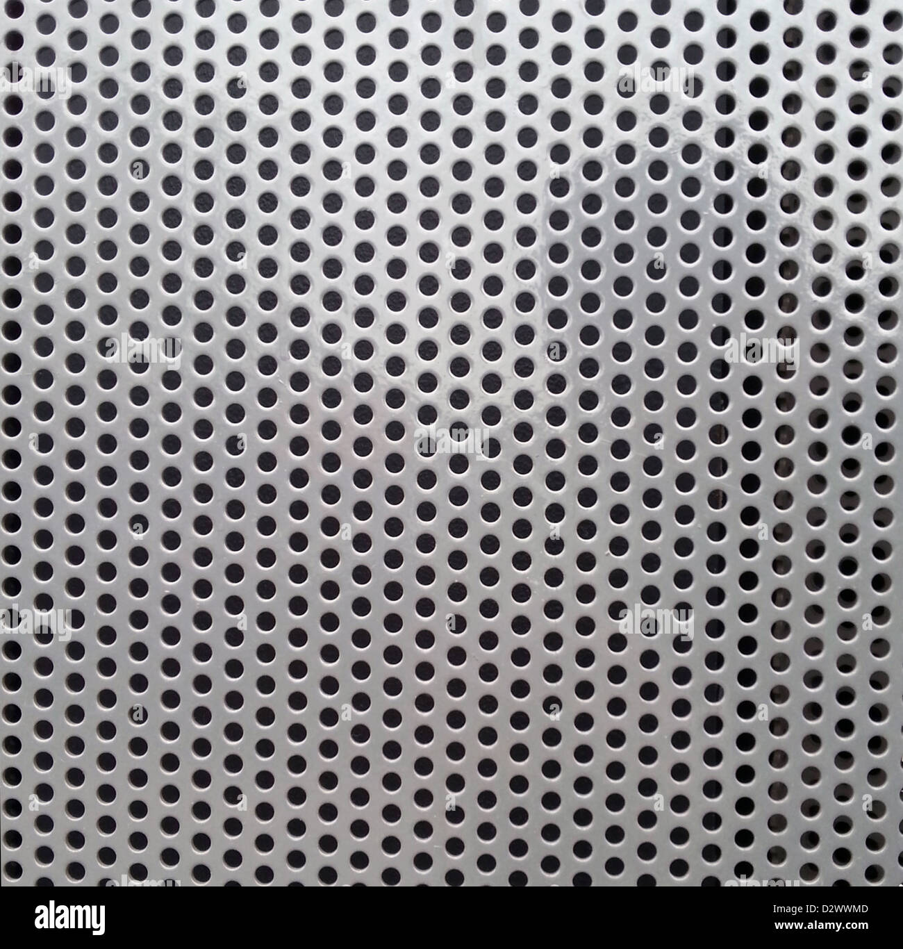 Metal background with holes Stock Photo - Alamy