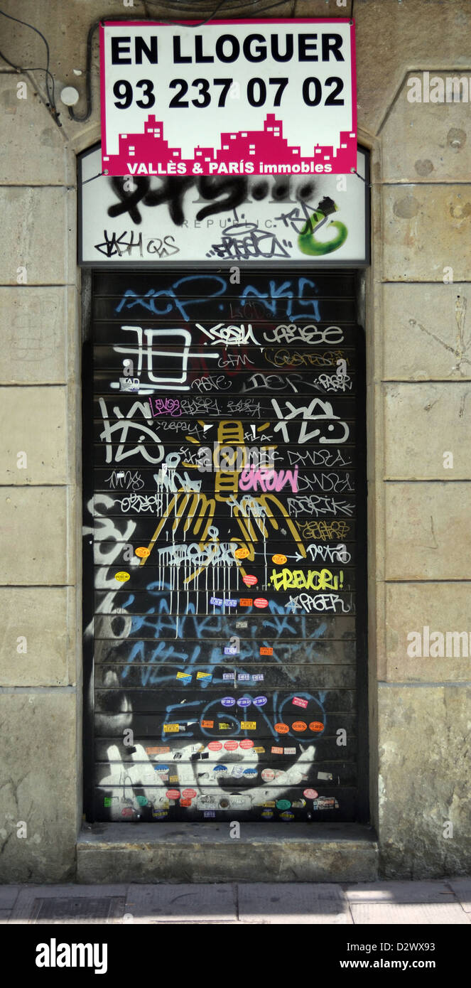 A storefront with graffiti in Barcelona, Spain right off Las Ramblas ...