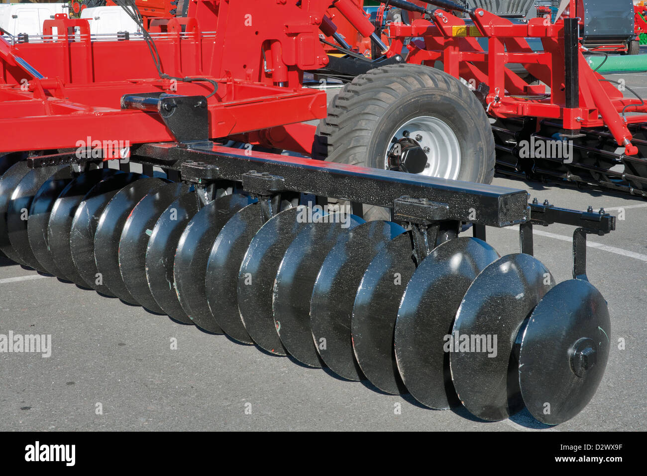Tractor plough details, black and red Stock Photo - Alamy