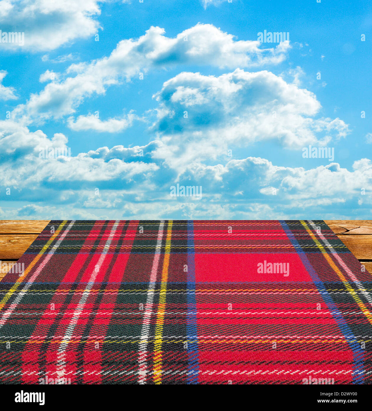 Tartam tablecloth table against blue sunny summer sky Stock Photo - Alamy
