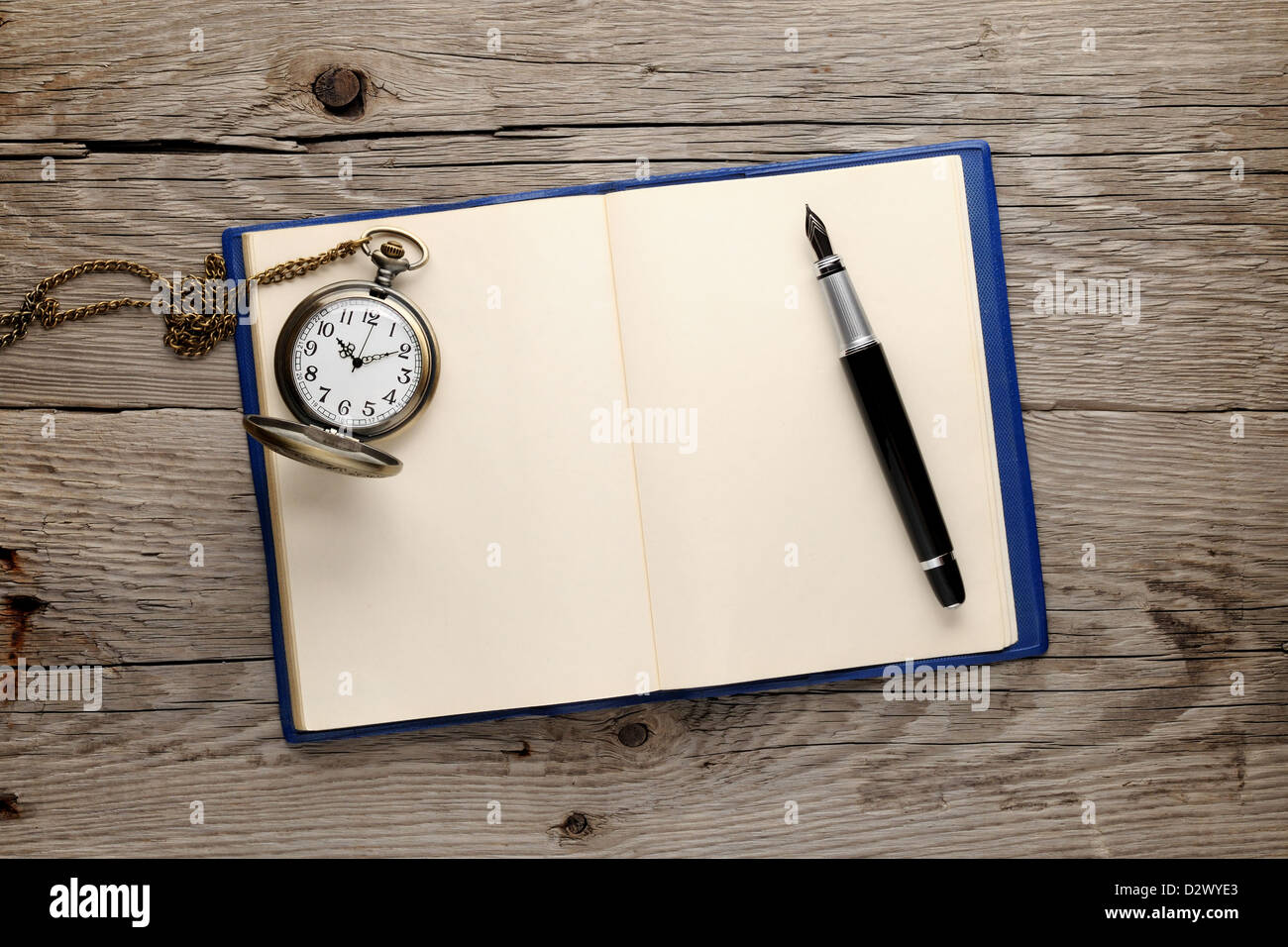 Antique watch and fountain pen on old note book Stock Photo - Alamy