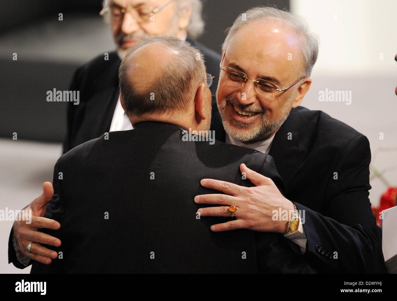 Iranian Foreign Minister, Ali Akbar Salehi (R), hugs NATO Secretary ...