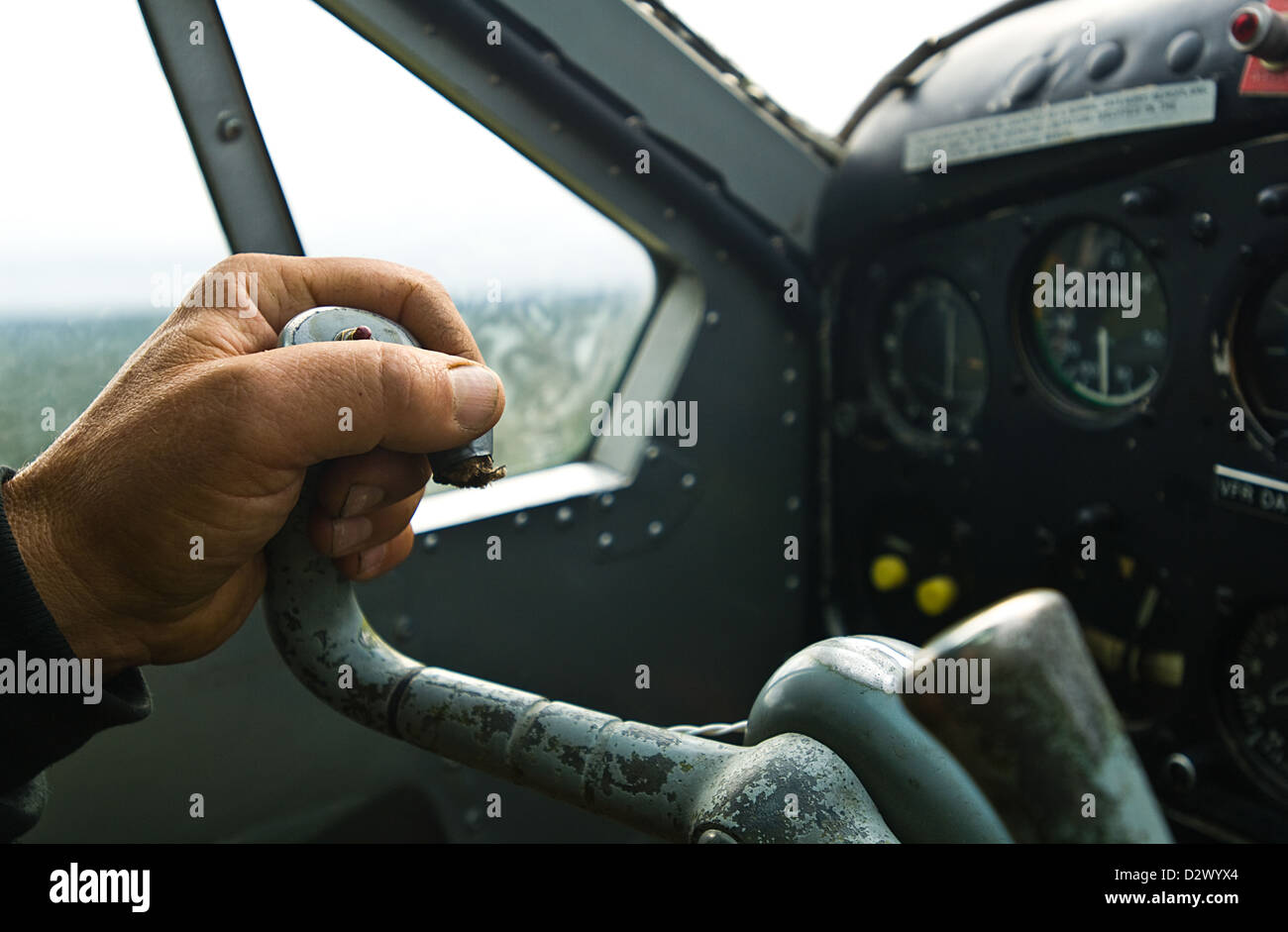 Pilot flying a DeHavilland Beaver floatplane near Dillingham Alaska ...