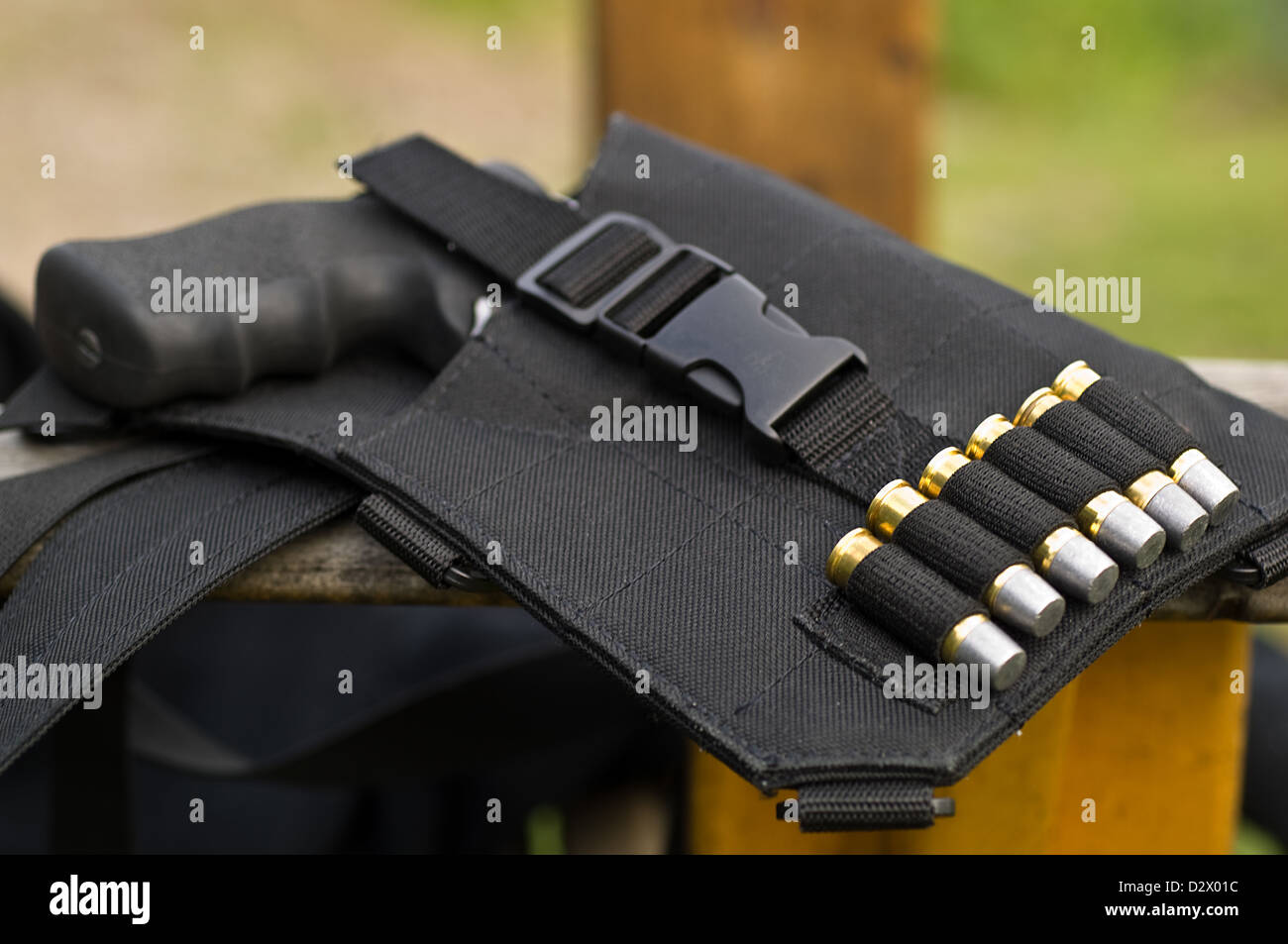 Pistol in holster with bullets Stock Photo - Alamy