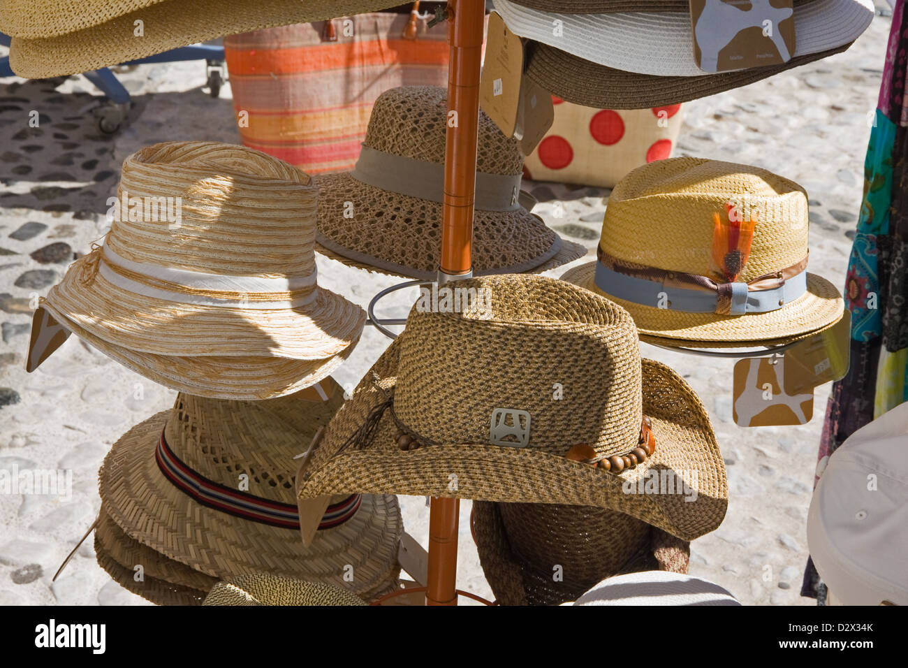 Straw sun hats on display outside shop in Frigiliana, Nerja, Spain ...