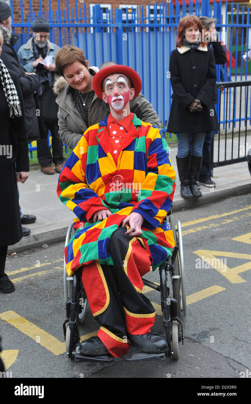 Dalston, London, UK. 3rd February 2013. A Clown in a wheelchair outside ...