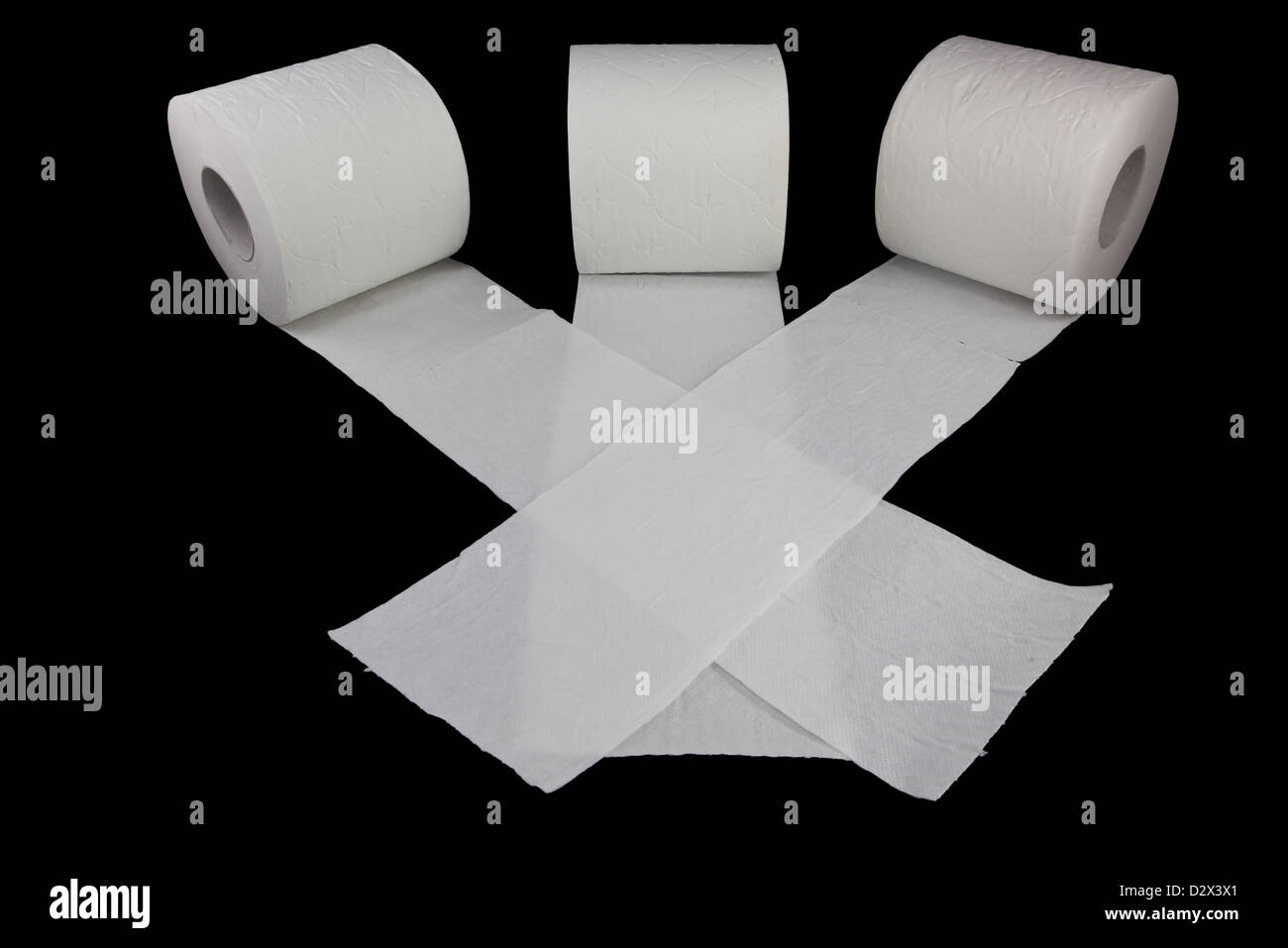Picture of three toilet rolls racing on a black background Stock Photo ...