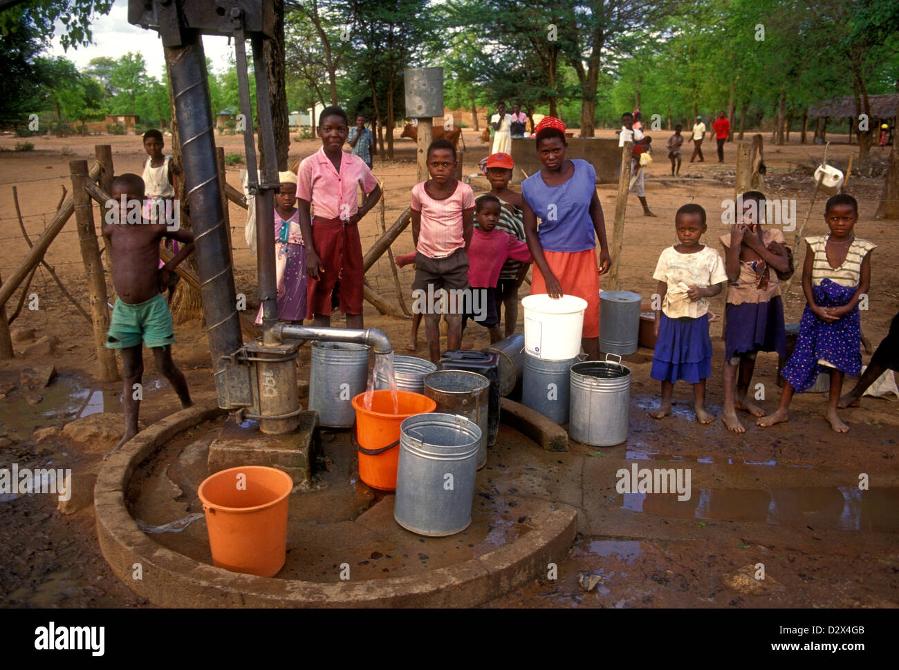 Zimbabwean people, women and children, pumping water from well, water ...