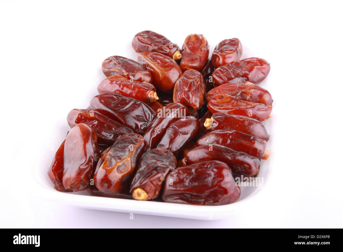 Group of dates isolated on white background Stock Photo - Alamy