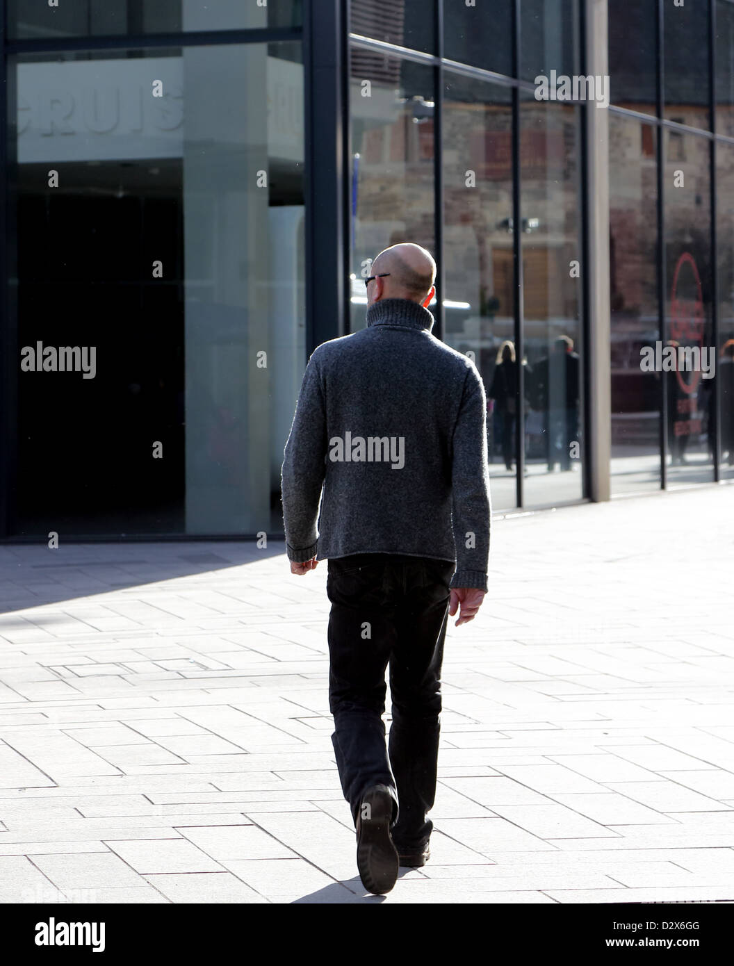 Bald man walking hi-res stock photography and images - Alamy