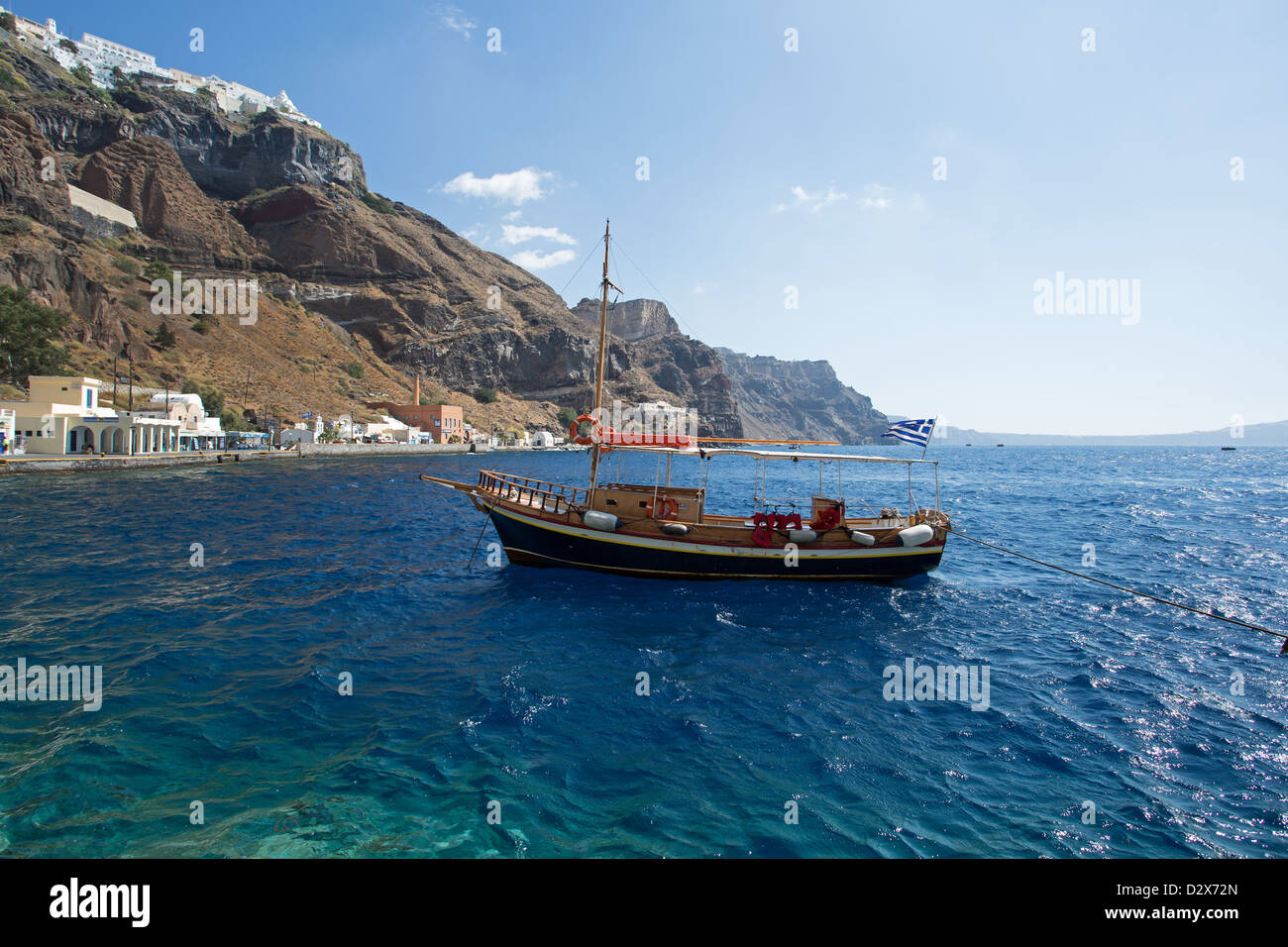 Ormos port at the bottom of Fira, Santorini. Anchored boat Stock Photo ...