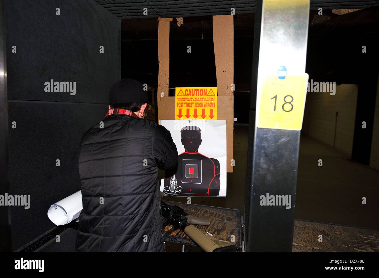Target shooting with an AR-style target rifle at an indoor range Stock ...
