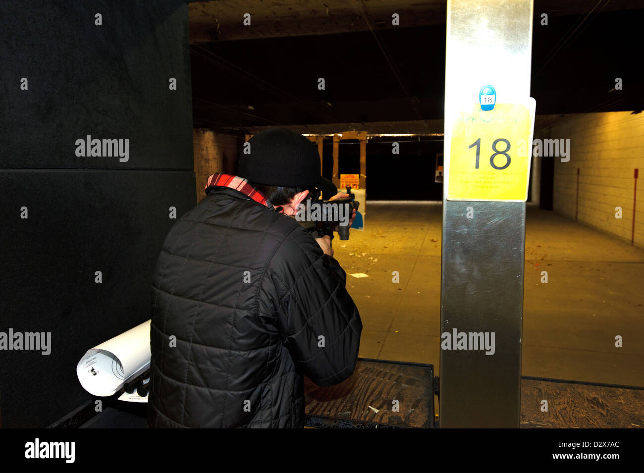 Target shooting with an AR-style target rifle at an indoor range Stock ...