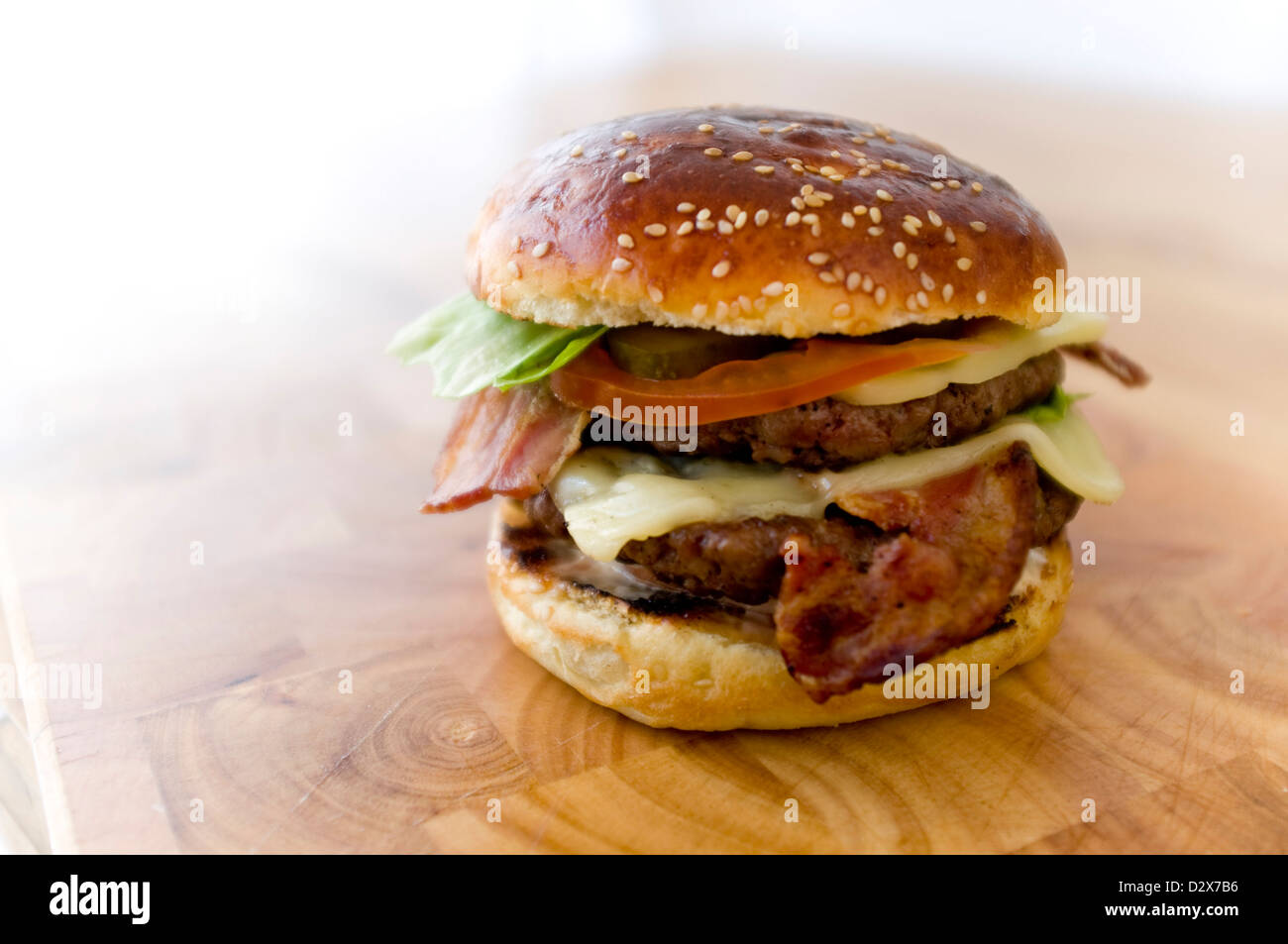 Double Cheese - Two burgers, layered with cheese, bacon, tomato ...