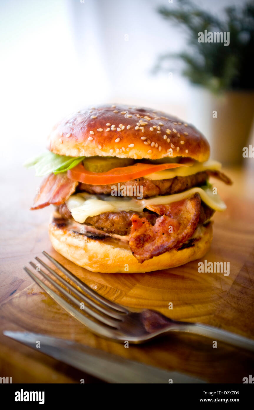 Double Cheese - Two burgers, layered with cheese, bacon, tomato ...