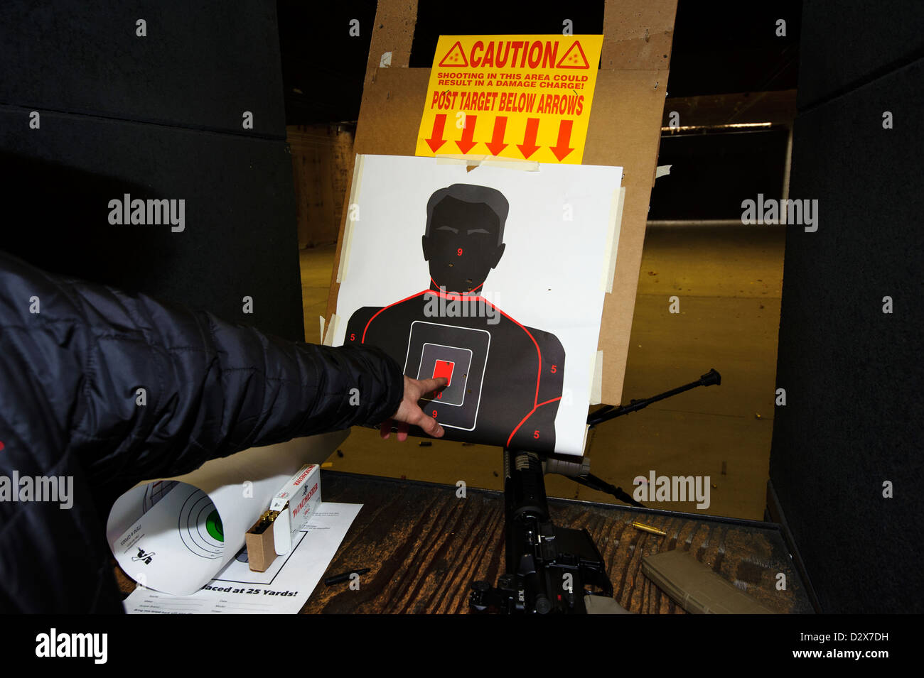 Target shooting with an AR-style target rifle at an indoor range Stock ...