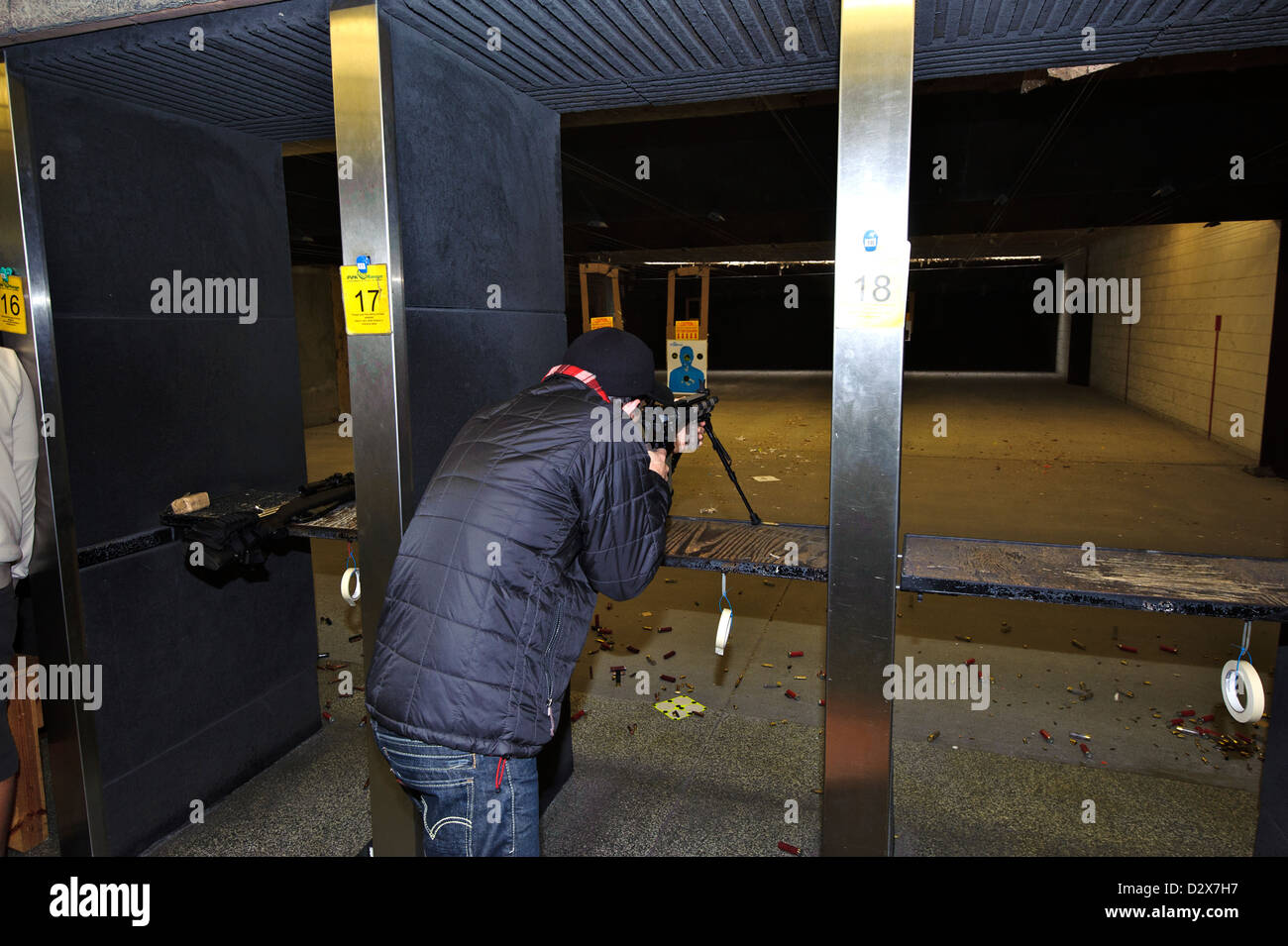 Target shooting with an AR-style target rifle at an indoor range Stock ...