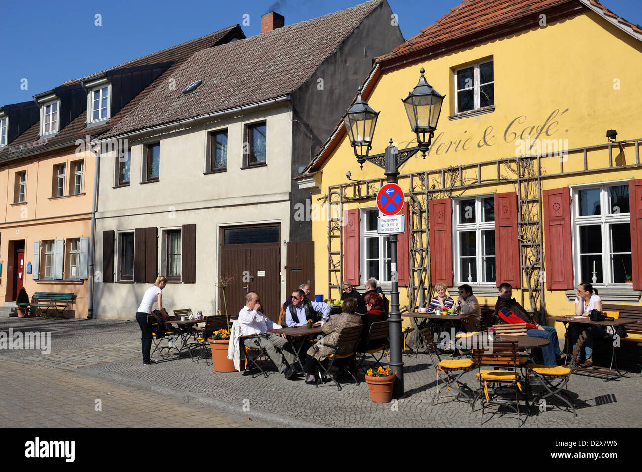 Werder, Germany, guests sit in front of the Gallery Cafe on the market ...