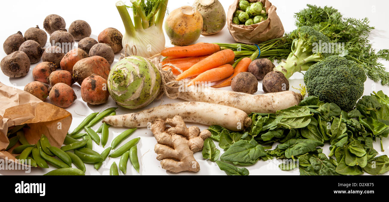Studio shot of raw vegetables crowded on a white surface Stock Photo ...