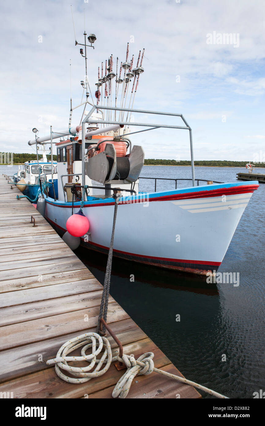 Small fishing boat at a bridge in Gotland, Sweden Stock Photo - Alamy