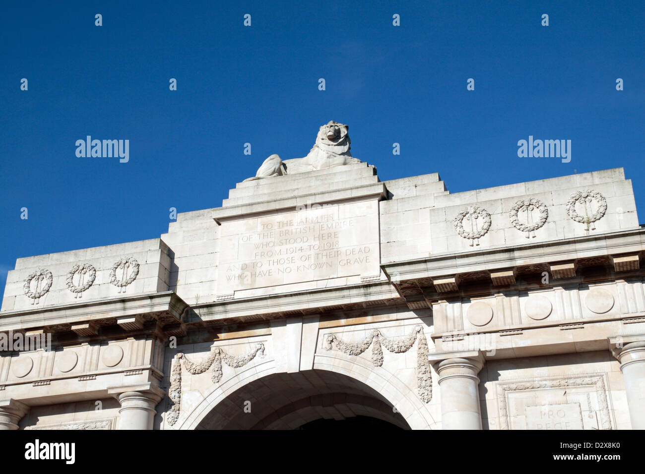 Sitting stone lion above the main arch inscription of the Menin Gate ...