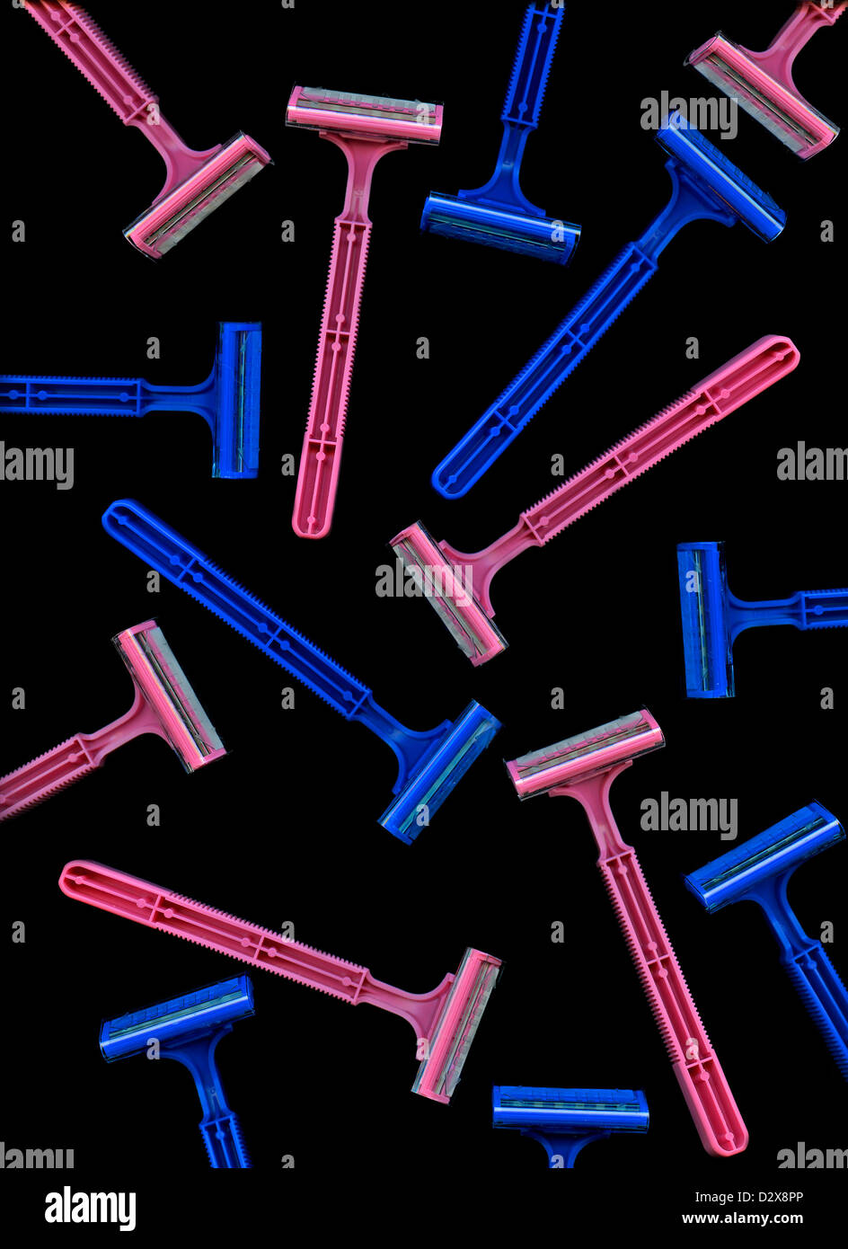 Pink and blue razors scattered on black background Stock Photo - Alamy