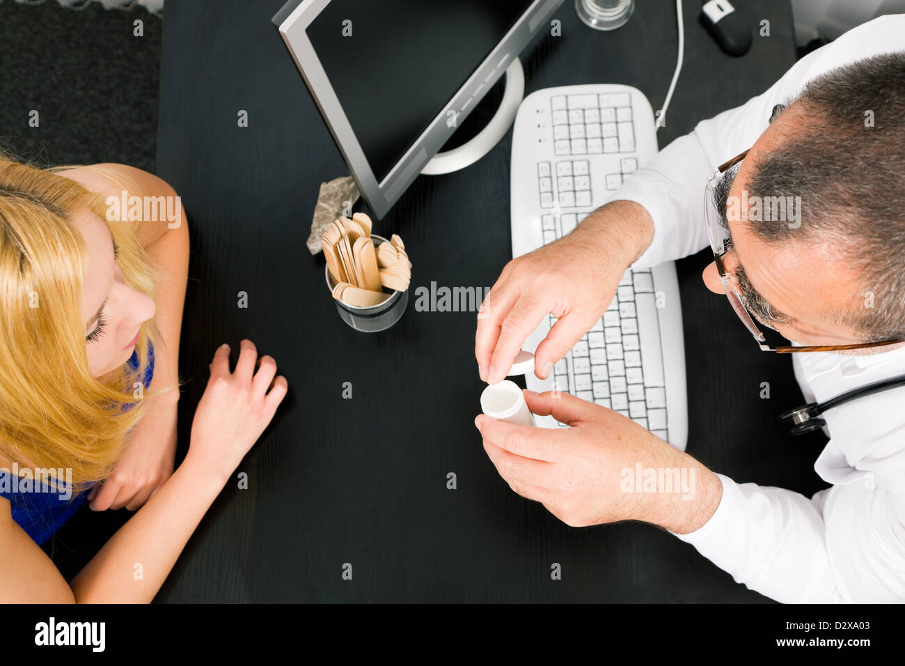 Consulting the doctor Stock Photo - Alamy
