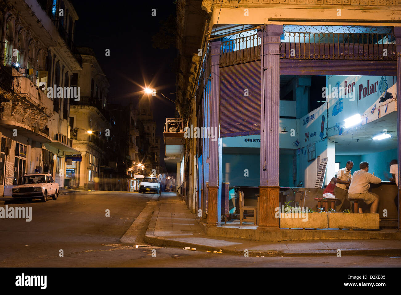 Night view of a bar in Havana, Cuba. Typical night scene, people are ...