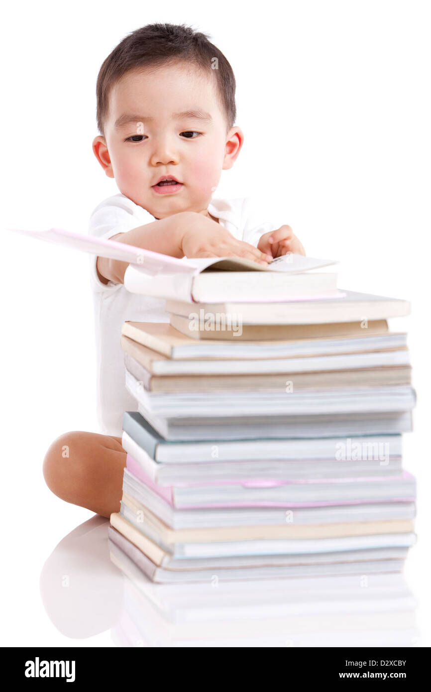 Adorable baby boy with books Stock Photo - Alamy