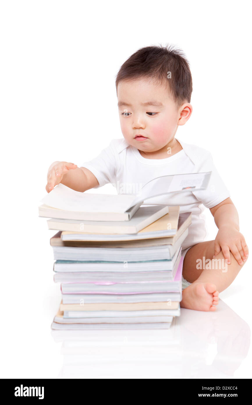 Adorable baby boy with books Stock Photo - Alamy