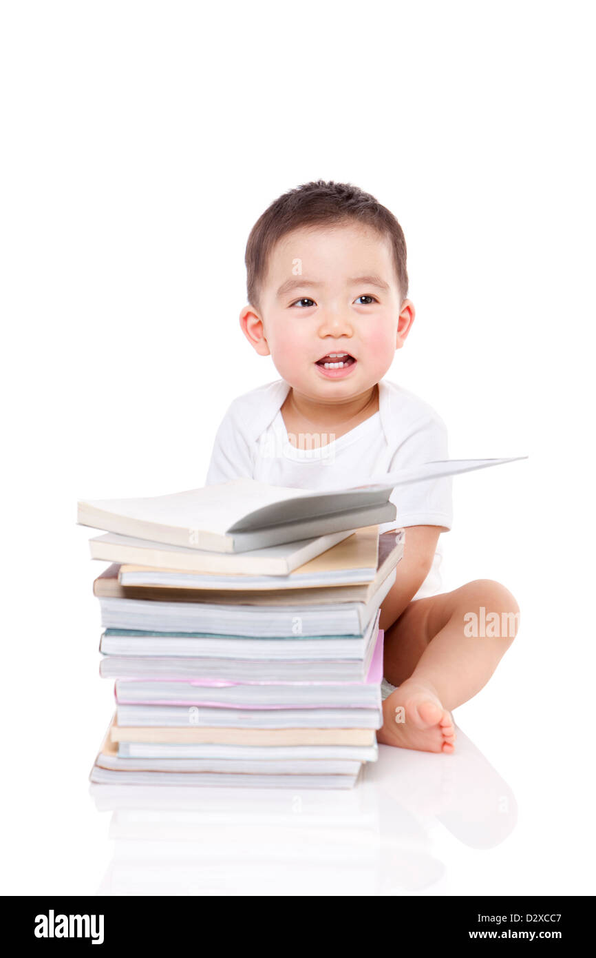 Happy baby boy with books Stock Photo - Alamy
