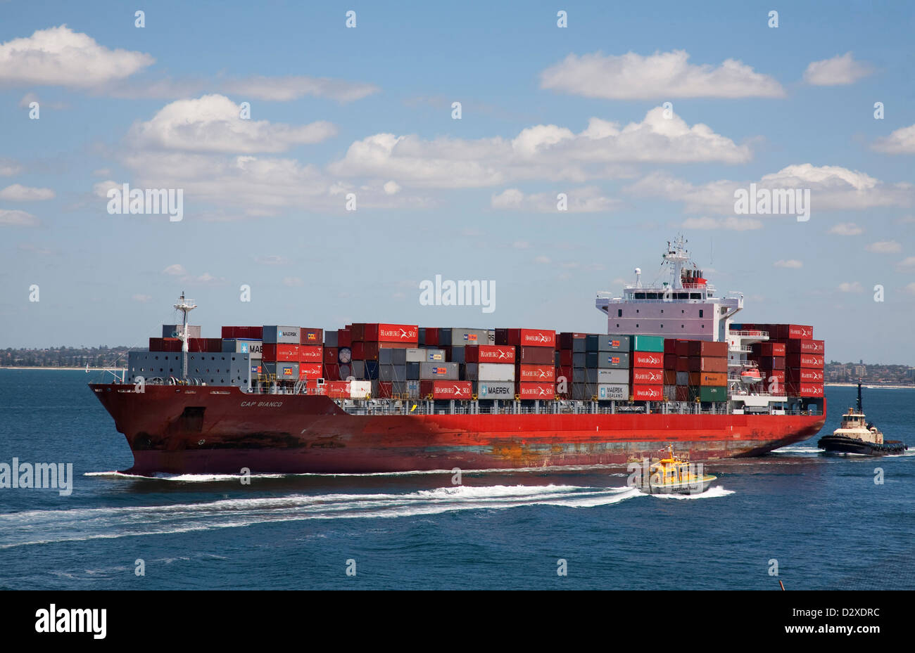 "Cap Bianco" Containership departing with assistance from pilot vessel ...