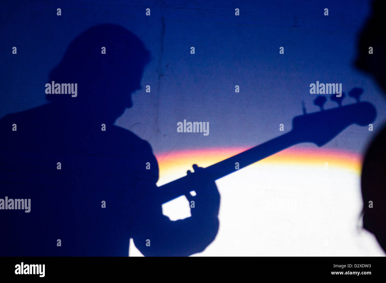 Silhouette of a Bass Player (David Goodier of Jethro Tull) playing his ...