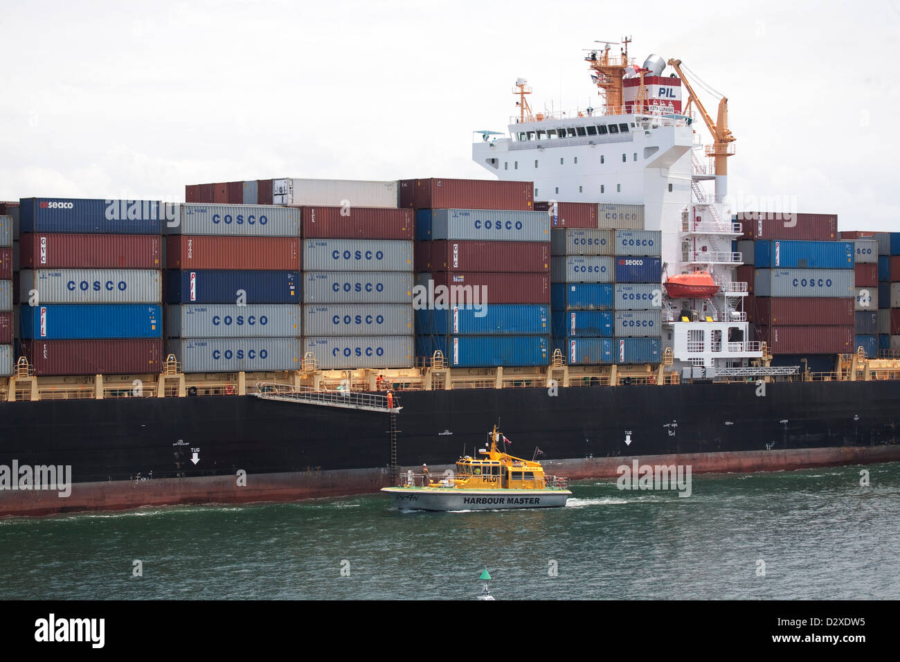 Pilot harbourmaster vessel alongside the Singapore owned Kota Lumayan ...