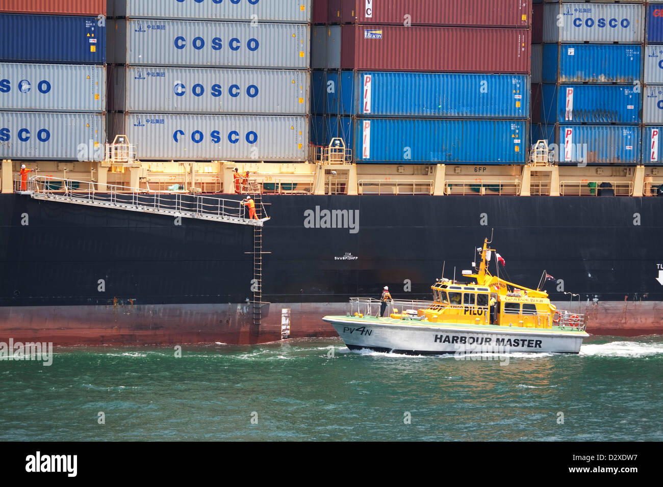 Pilot harbourmaster vessel alongside the Singapore owned Kota Lumayan ...