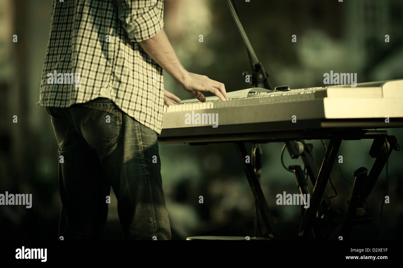 young man playing electronic keyboard, selective focus Stock Photo - Alamy