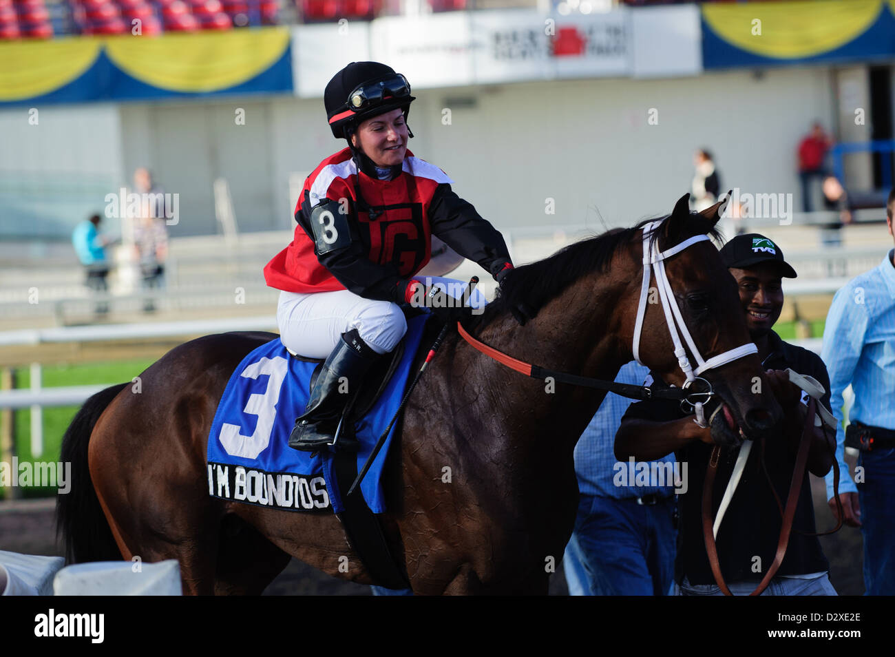 I'm Boundtoscore, with jockey Sarah Rook makes their way to the Winners ...