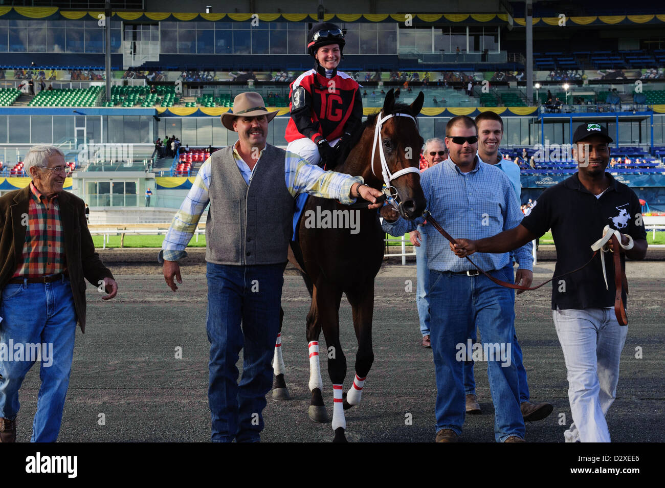 I'm Boundtoscore, with jockey Sarah Rook makes their way to the Winners ...