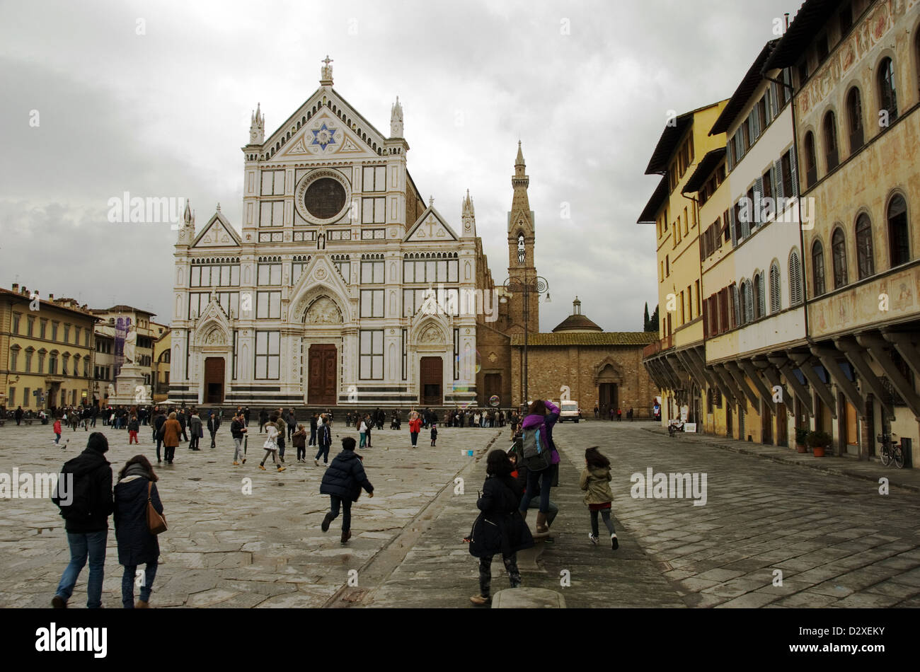 Sante Croce square filled with people in winter weather and the Sante ...