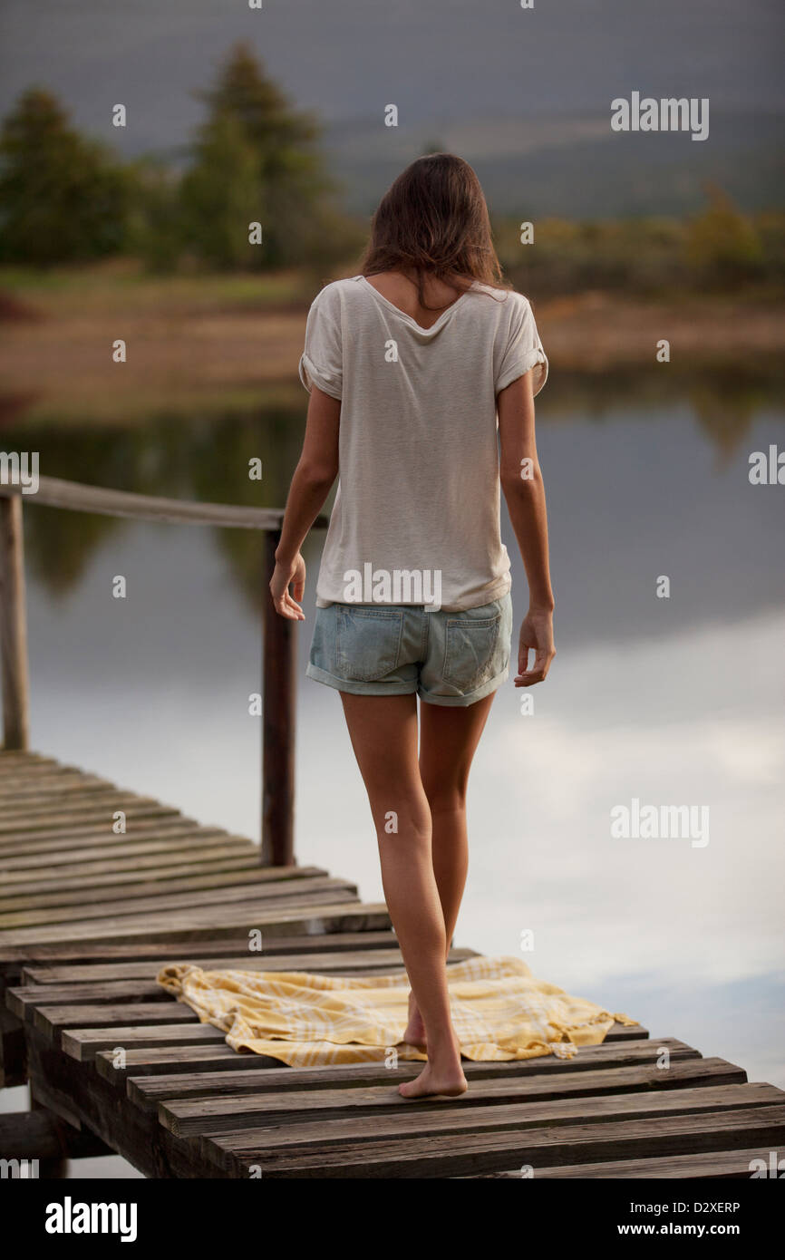 Female person walking lake pier hi-res stock photography and images - Alamy