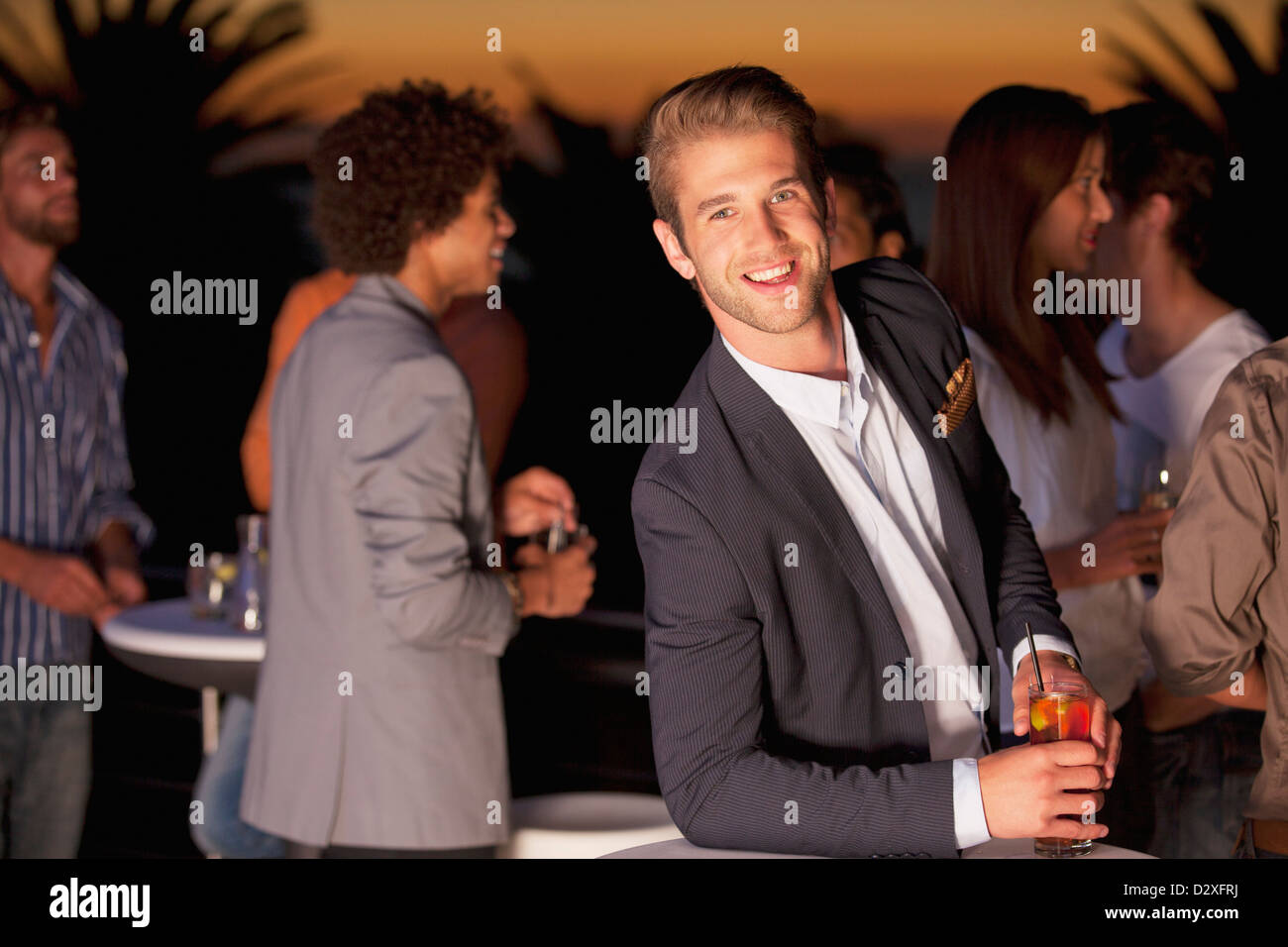 Cocktail party attire hi-res stock photography and images - Alamy