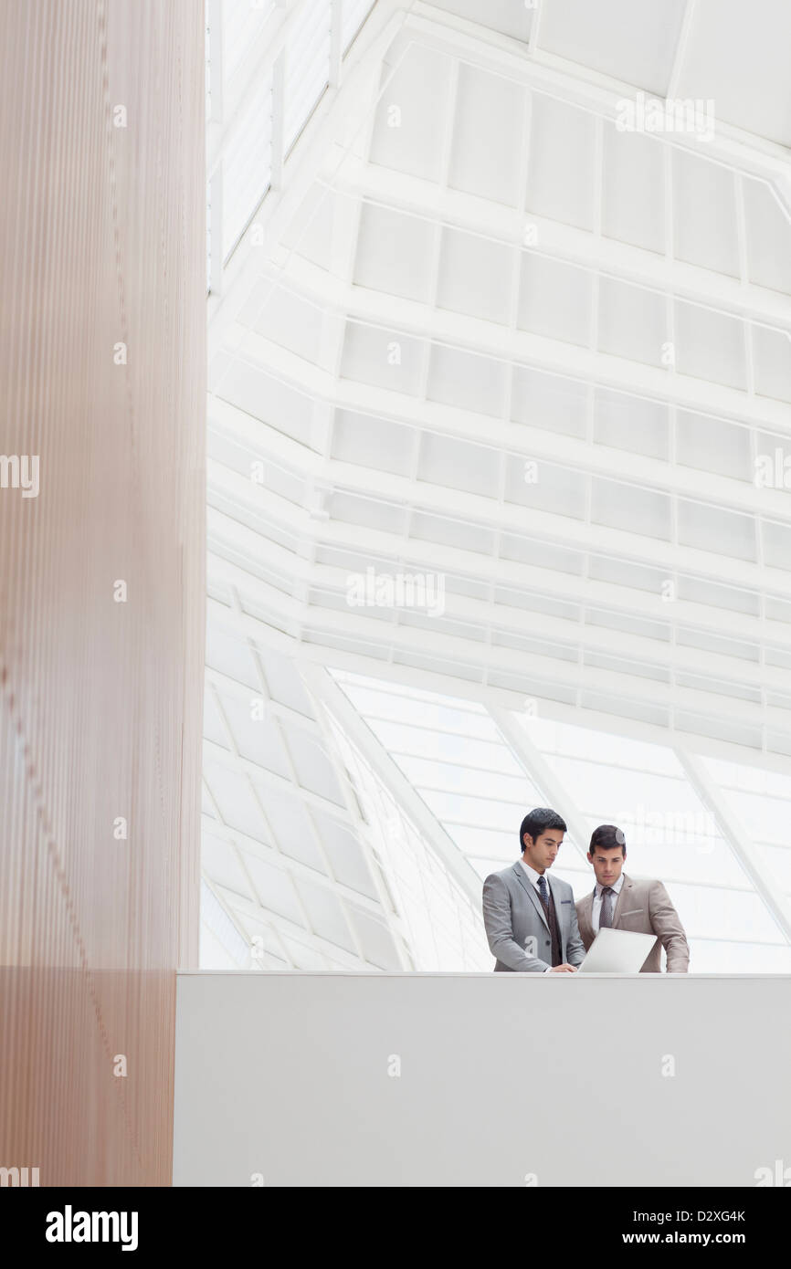 Two young businessmen working together in co working space hi-res stock ...