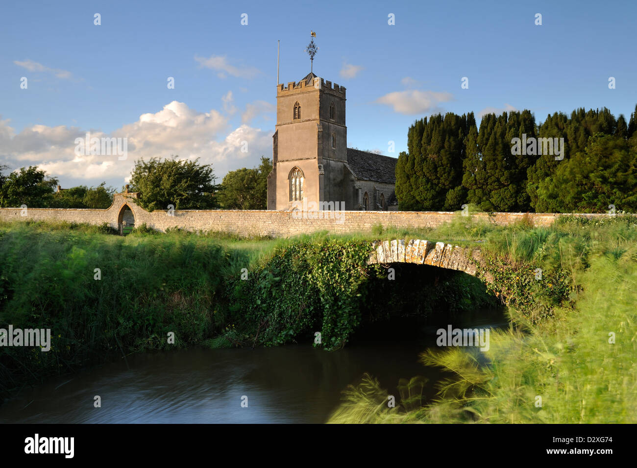 St Dunstan's Church and packhorse bridge in the village of ...