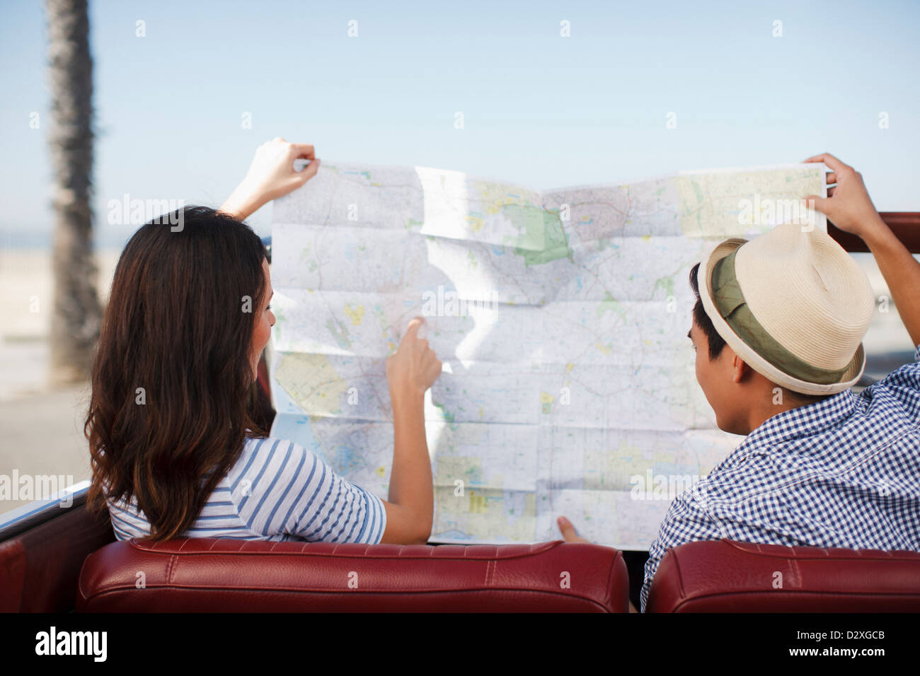 Woman examining road map hi-res stock photography and images - Alamy